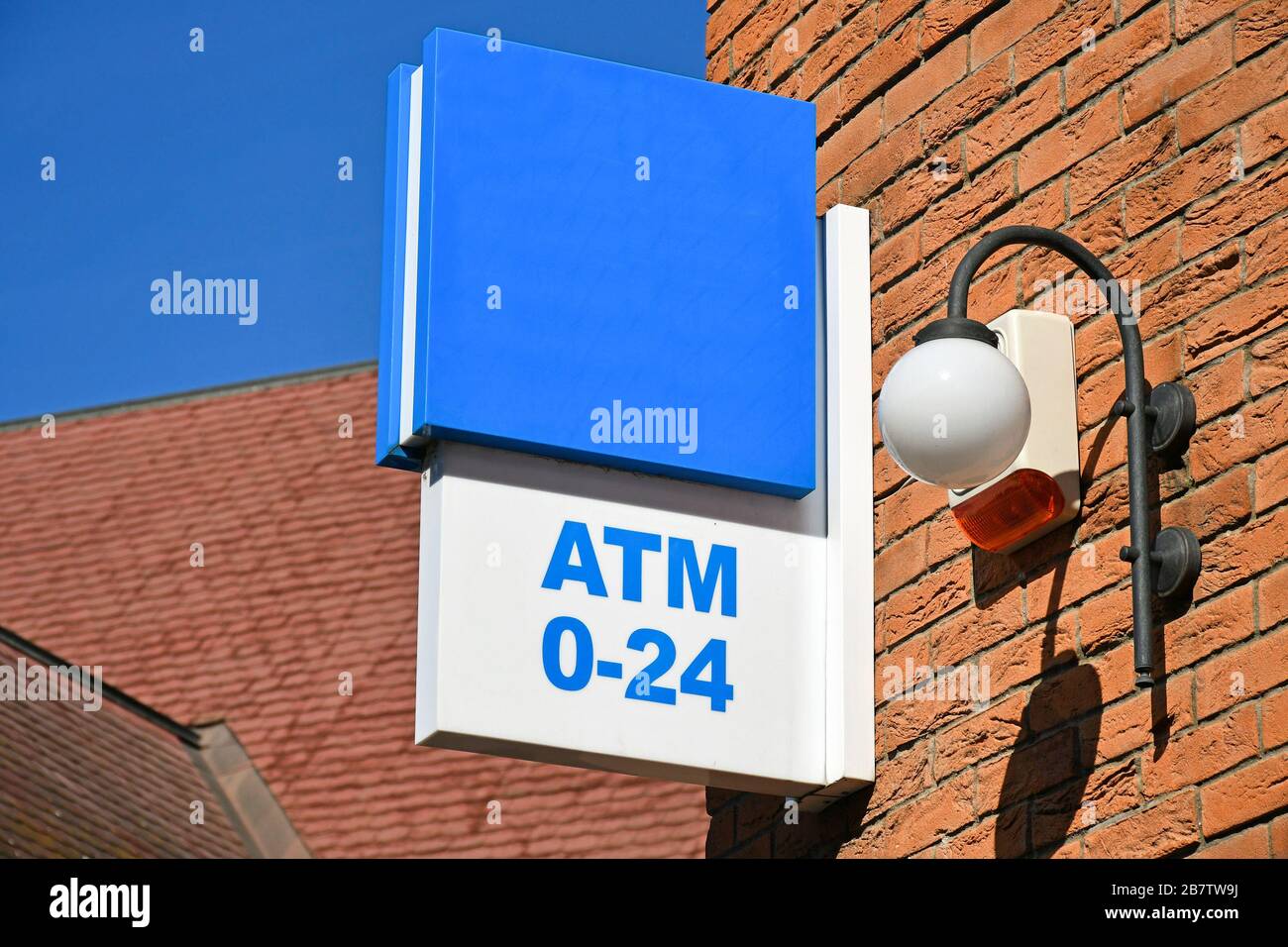 ATM sign on the wall of the bank building Stock Photo - Alamy