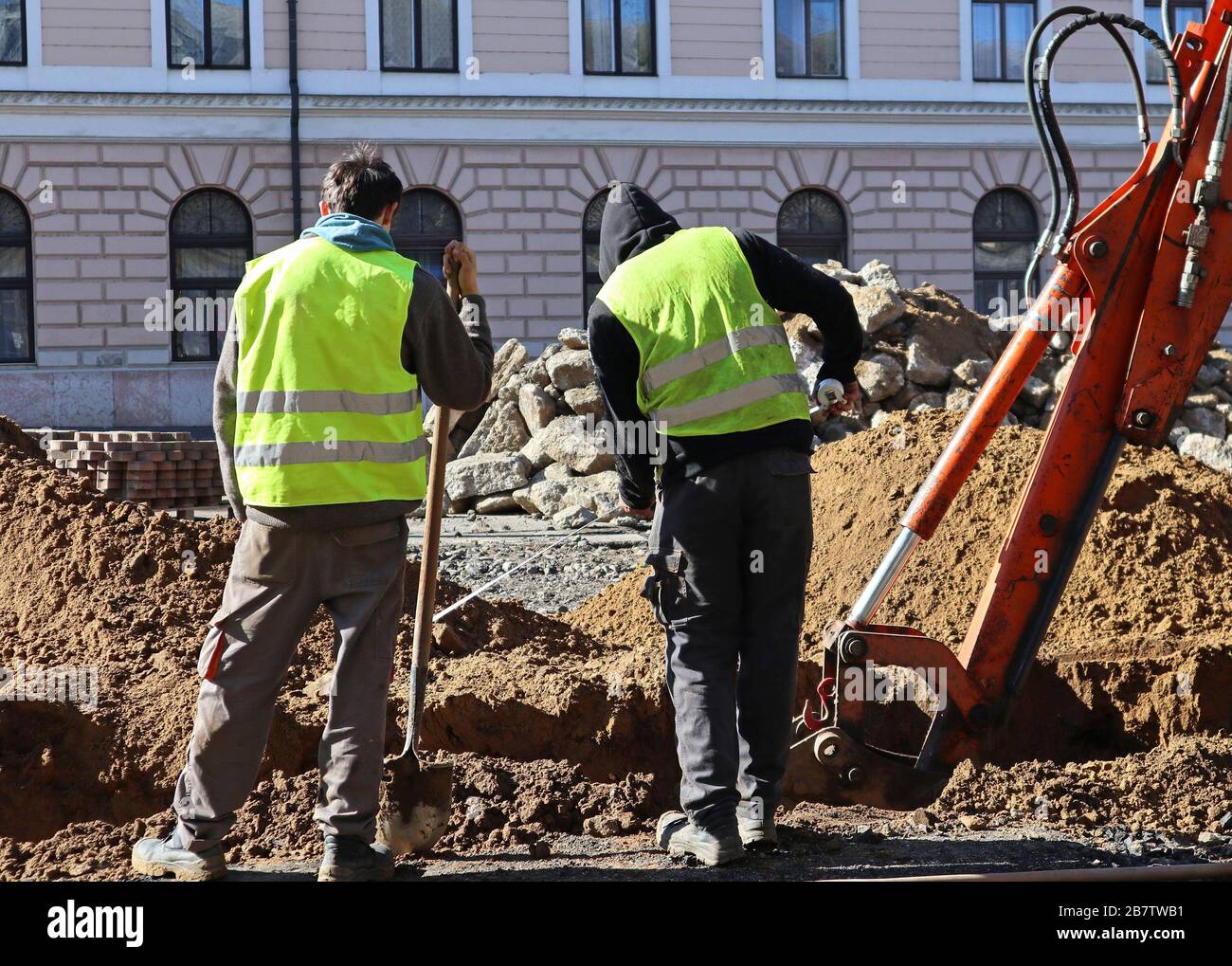 Men are working at the road construction Stock Photo - Alamy