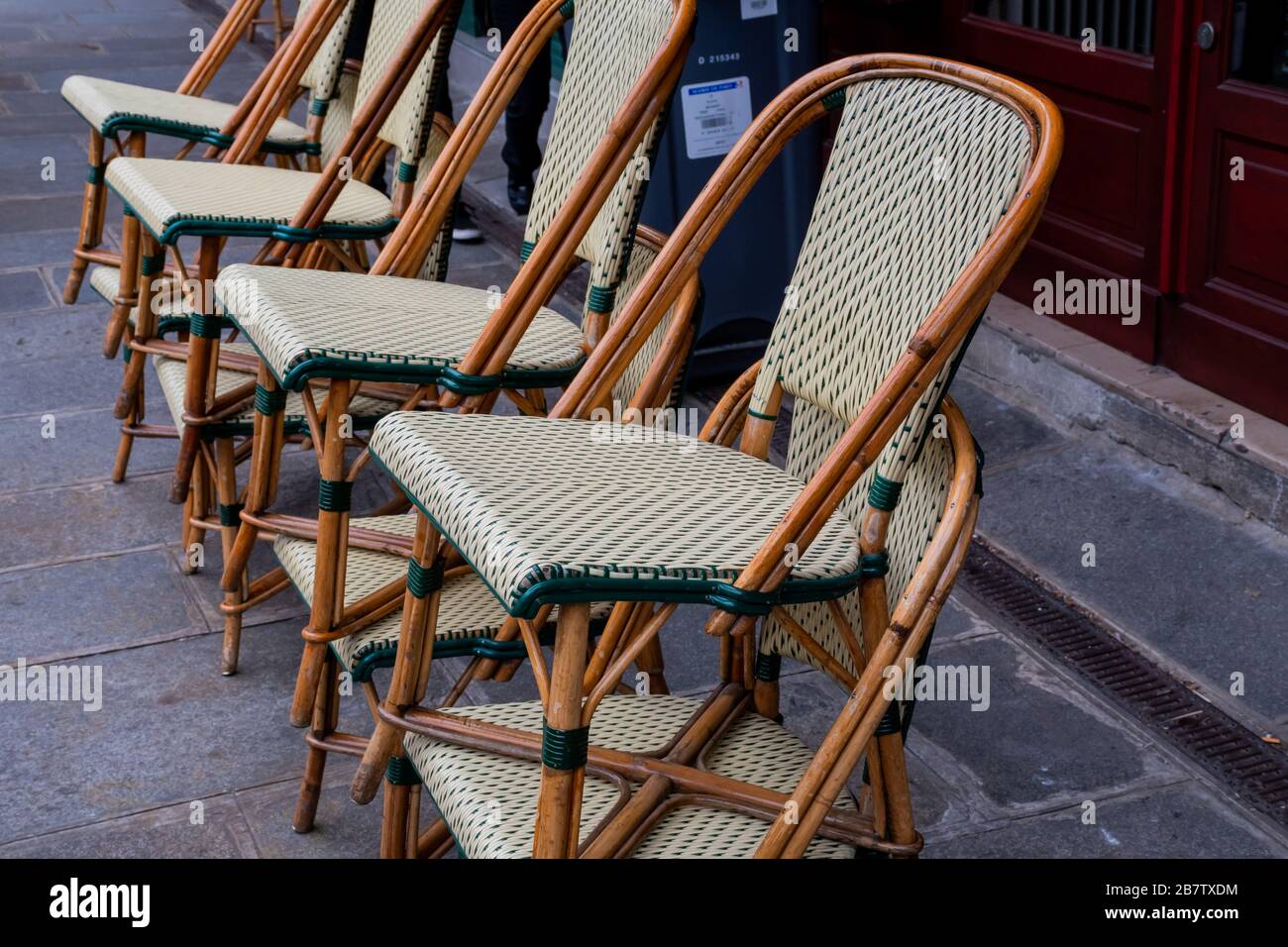 A morning shot of chairs collected outside a cafe in Paris prior to ...