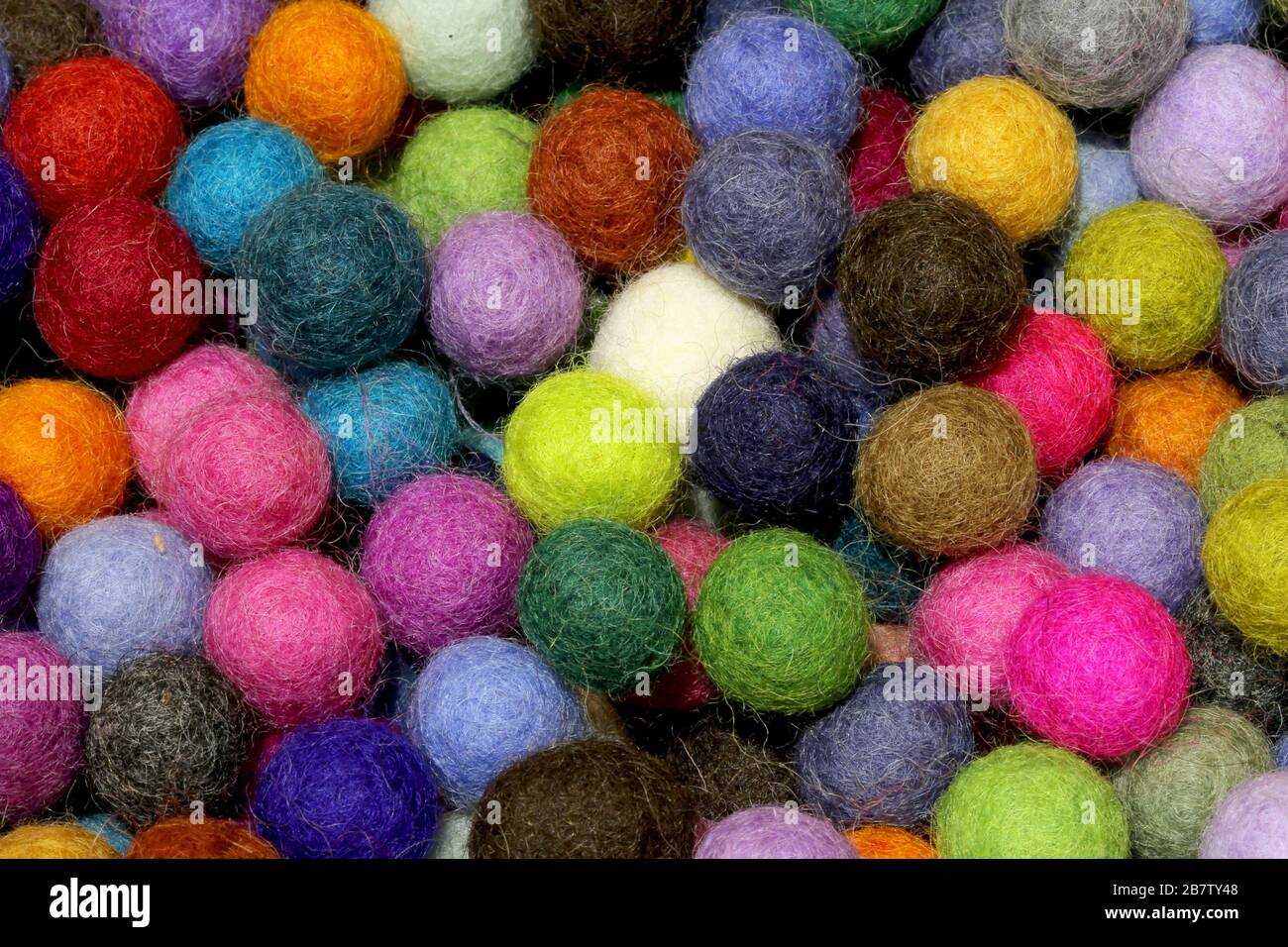 background of many balls made of wool for sale in the shop Stock Photo ...