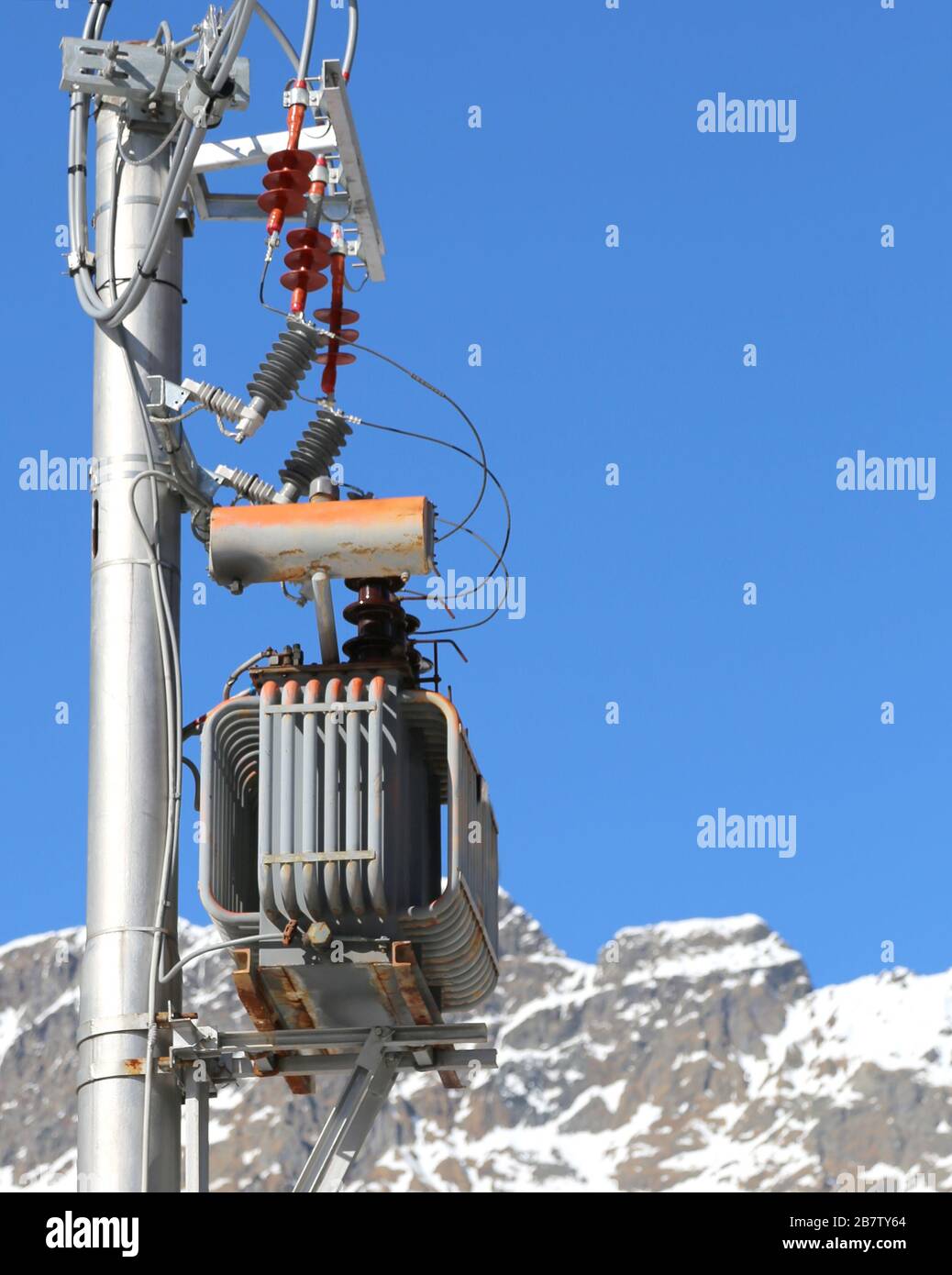 pole with electric transformer and high voltage electrical cables Stock ...