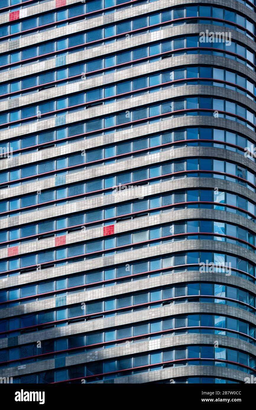 close-up of glass office building facade with windows, texture ...