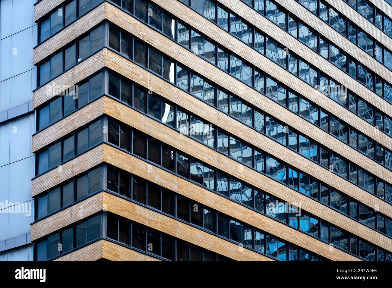 close-up of glass office building facade with windows, texture ...