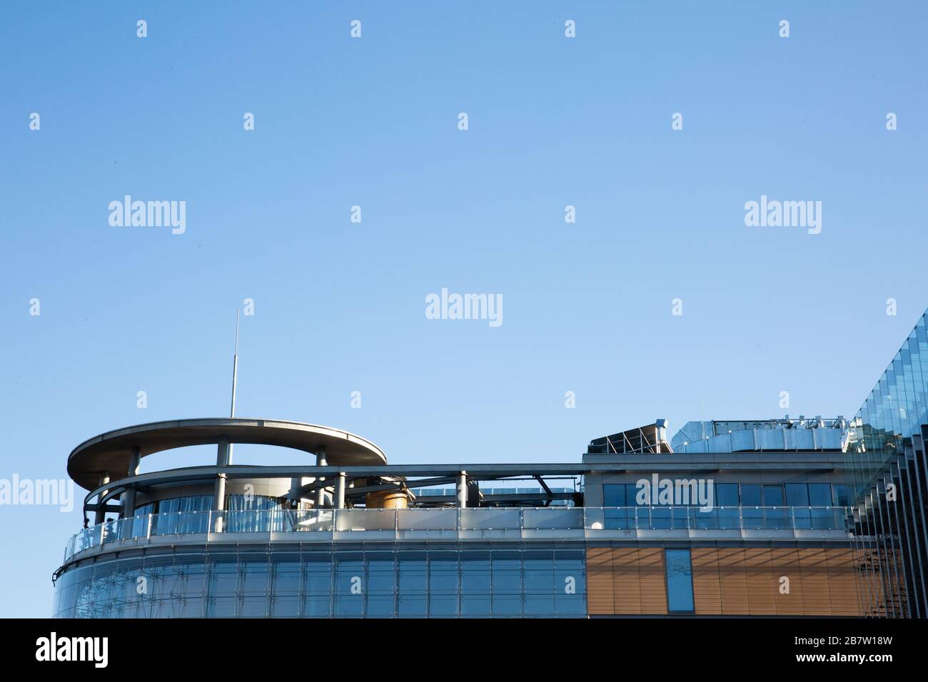 A modern and at the same time high building with a glass facade and ...