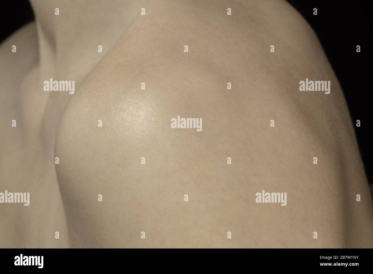 Shoulders. Detailed texture of human skin. Close up shot of young ...