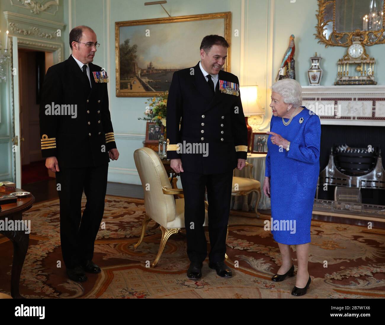 Queen Elizabeth II receives Commodore Steven Moorhouse (centre ...