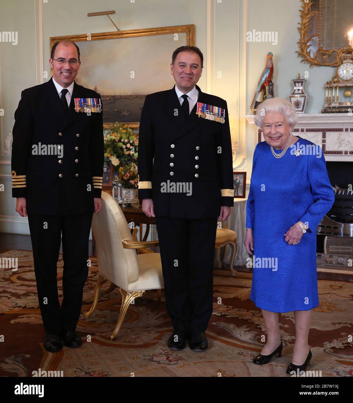 Queen Elizabeth II receives Commodore Steven Moorhouse (centre ...