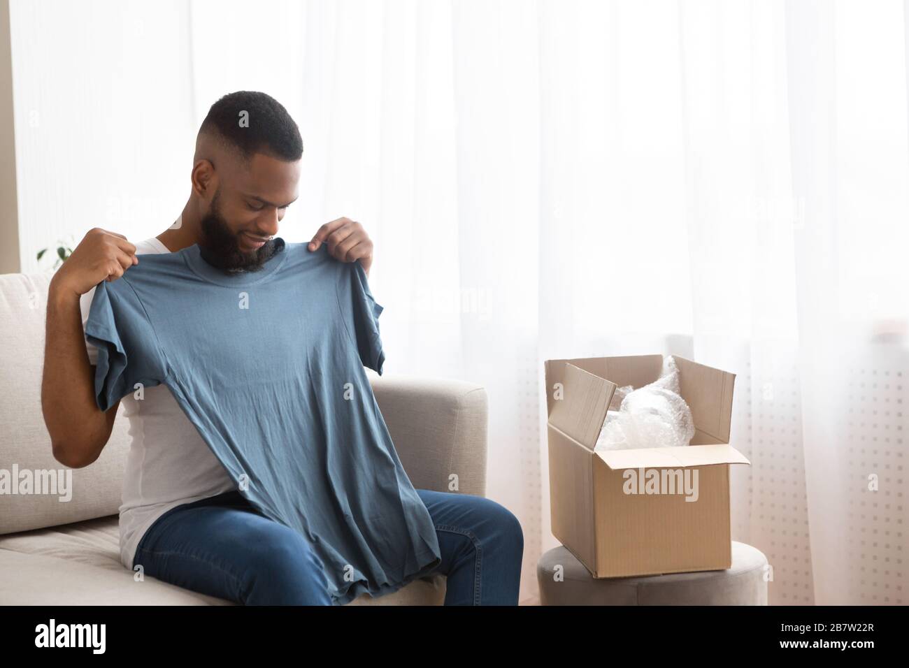 African man unpacking store hi-res stock photography and images - Alamy