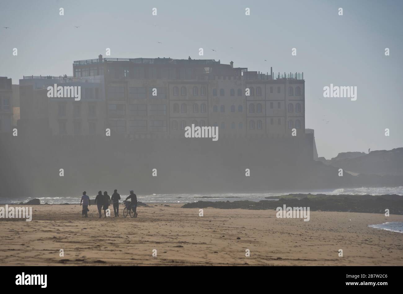 People walking on the beach by Atlantic Ocean in Essaouira,Morocco ...