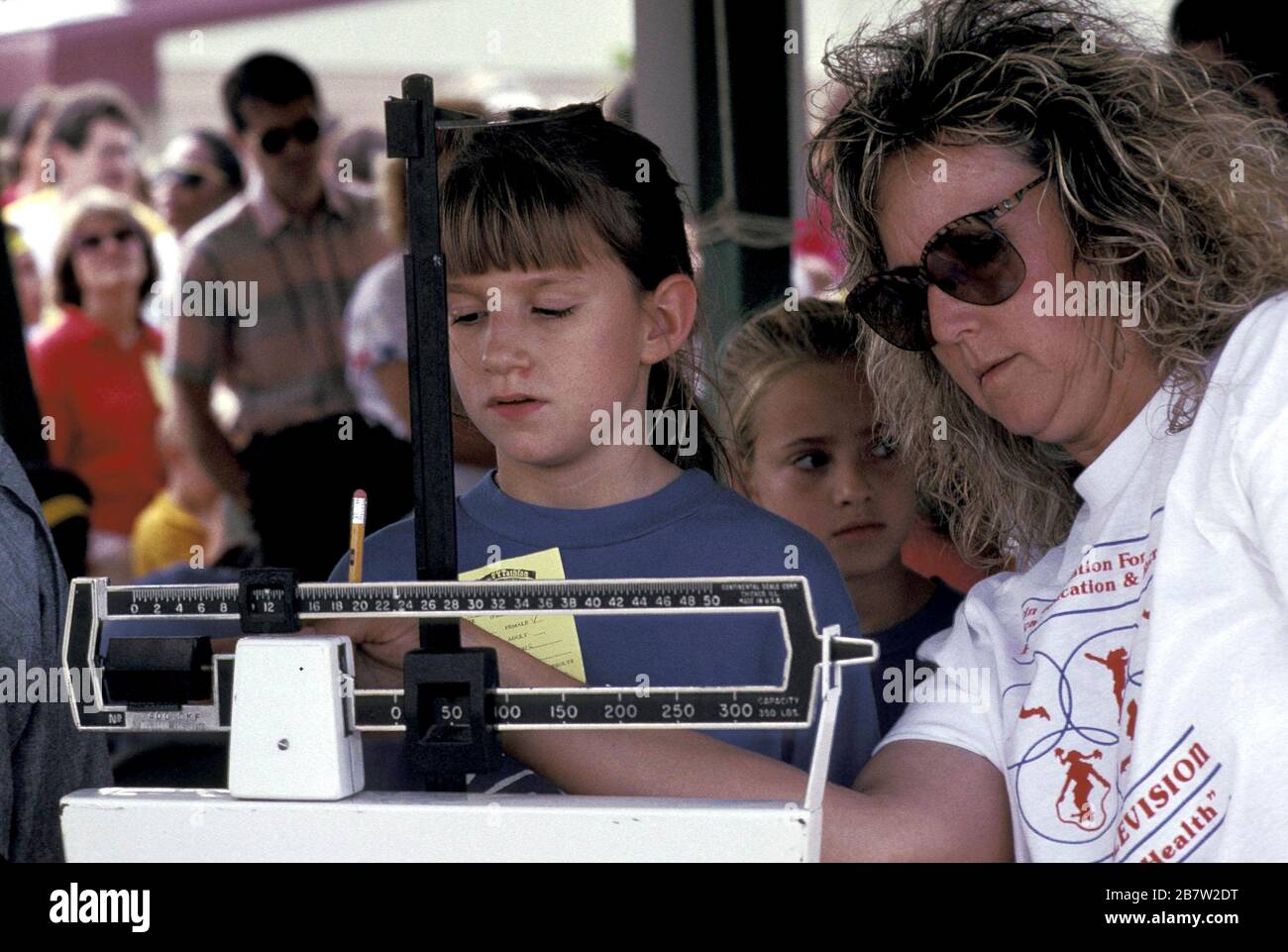 Austin Texas USA: Eight-year-old girl stands on scale to find her ...