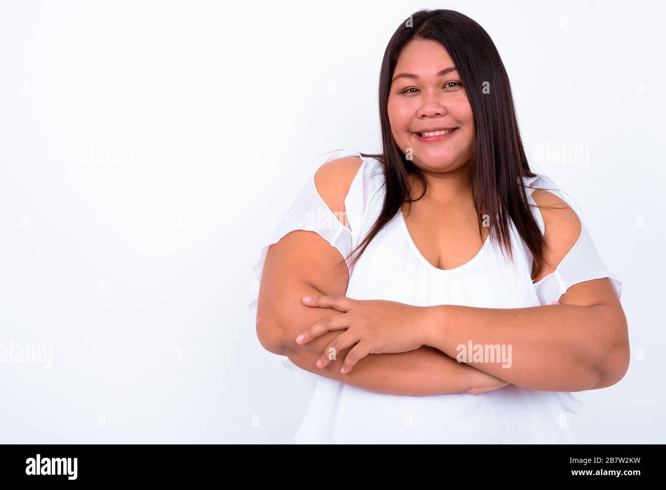 Beautiful overweight Asian woman against white background Stock Photo ...