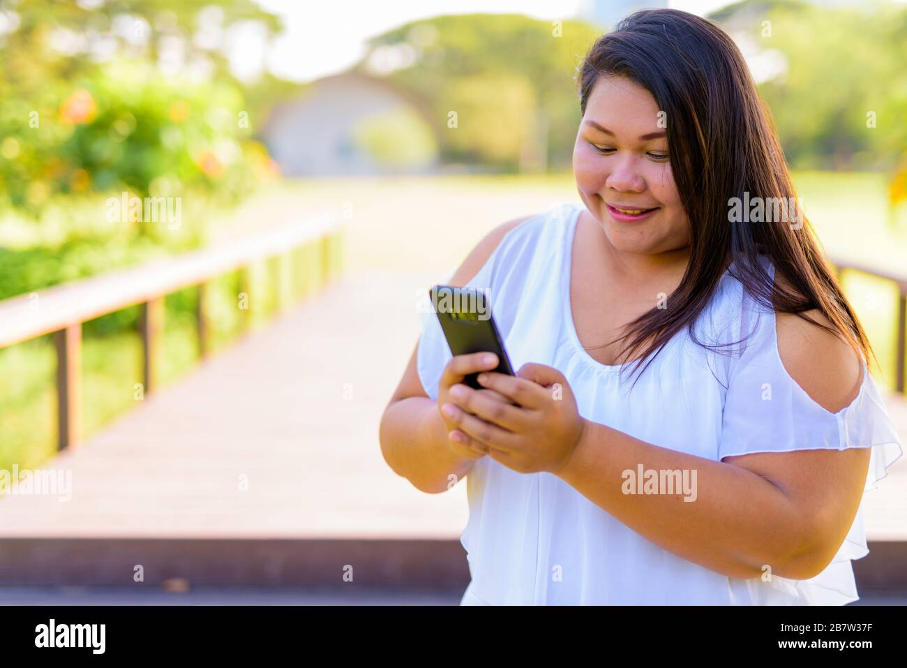 Beautiful overweight asian woman using hi-res stock photography and ...
