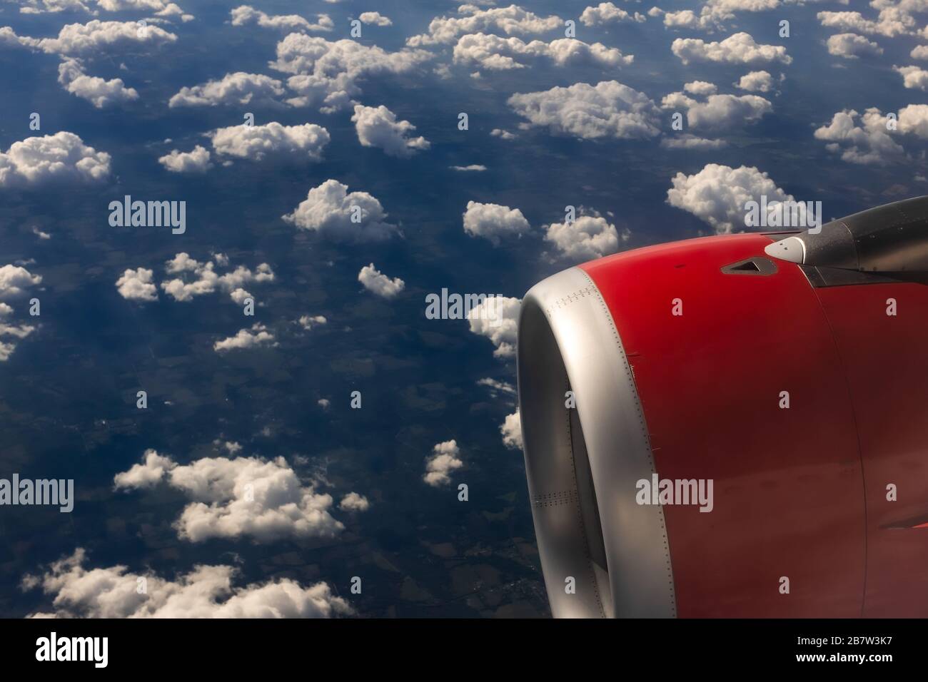 A colour landscape image looking out through airplane window showing ...