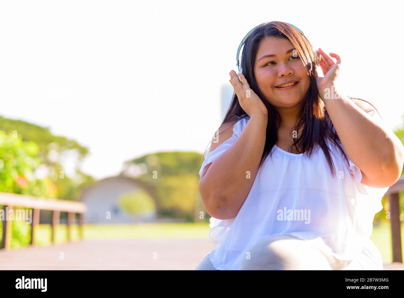 Happy overweight asian woman thinking hi-res stock photography and ...