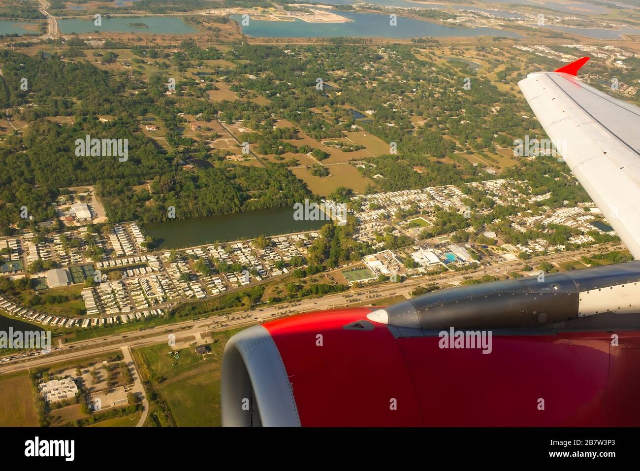 A colour landscape image looking out through airplane window showing ...