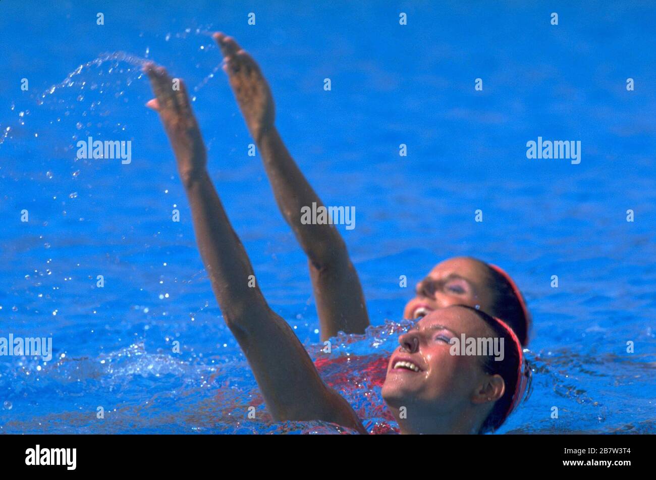 Synchronized swimmers performing in team competition at Summer Olympics ...