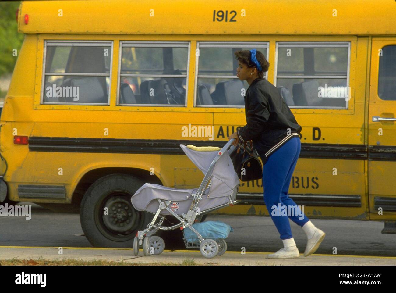 Austin, Texas USA: Teen mother with her baby in a baby stroller arrives ...