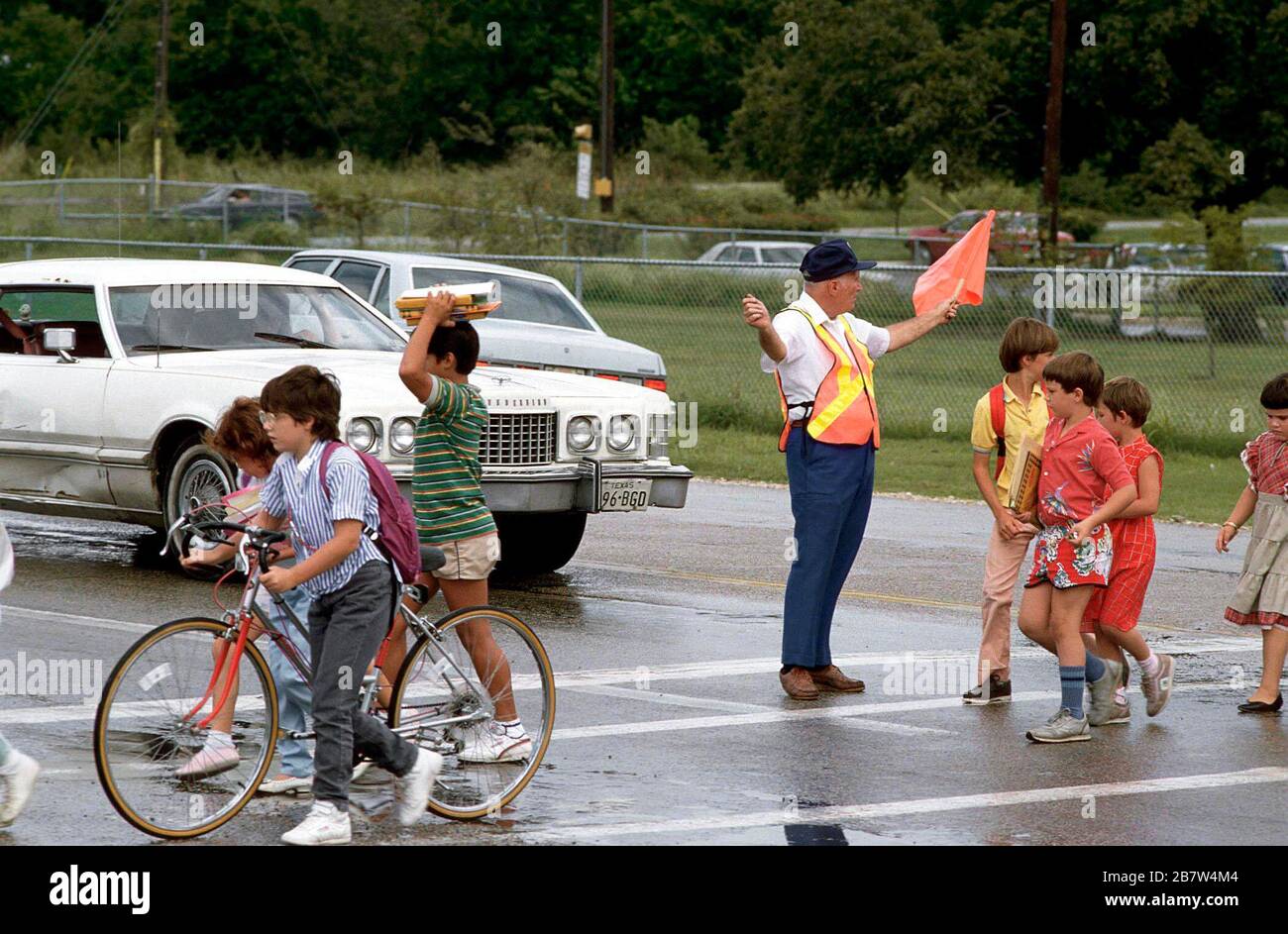 Austin, Texas USA: School crossing guard directing pedestrian and ...