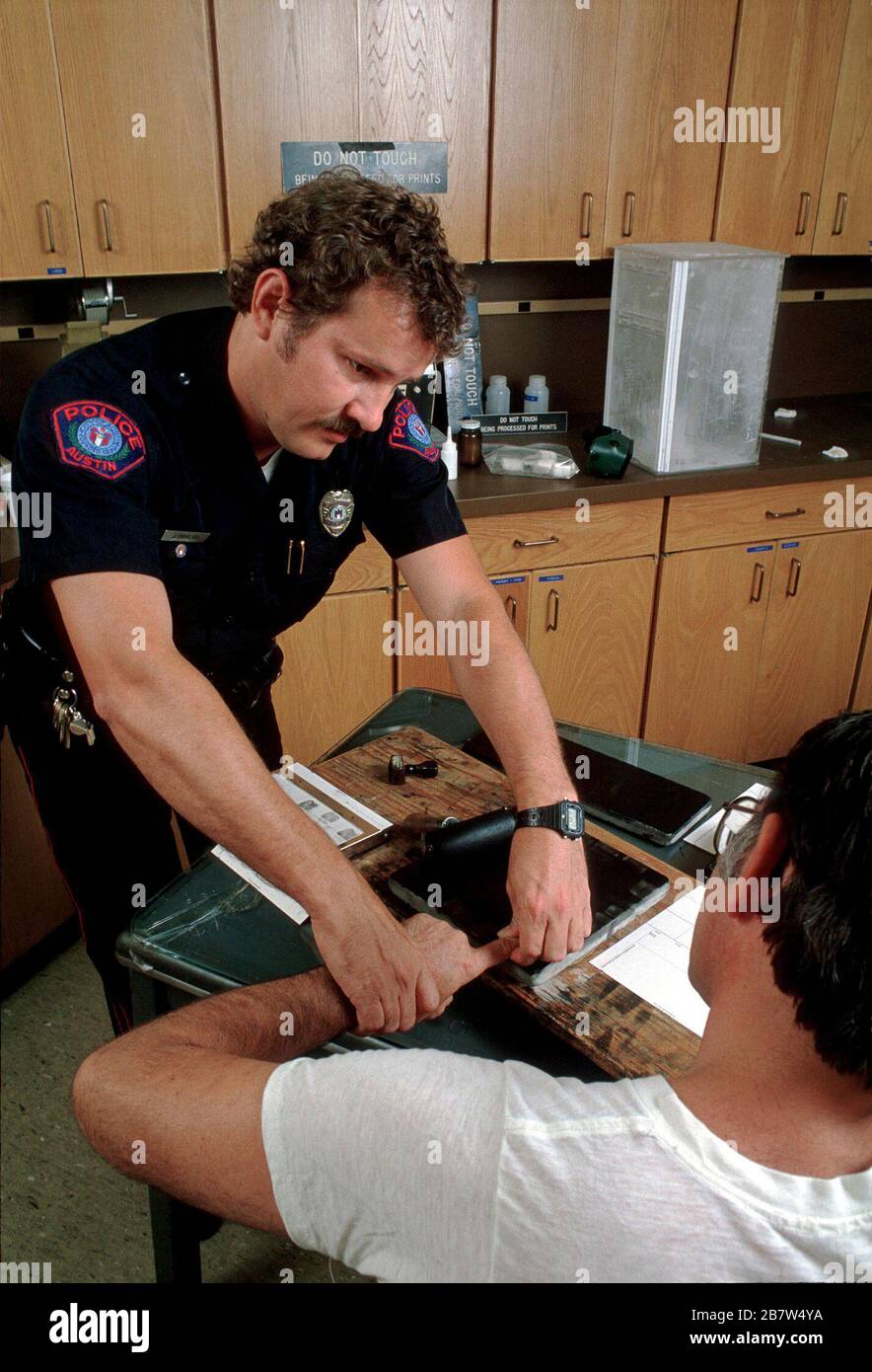 Police officer is taking fingerprints hi-res stock photography and ...