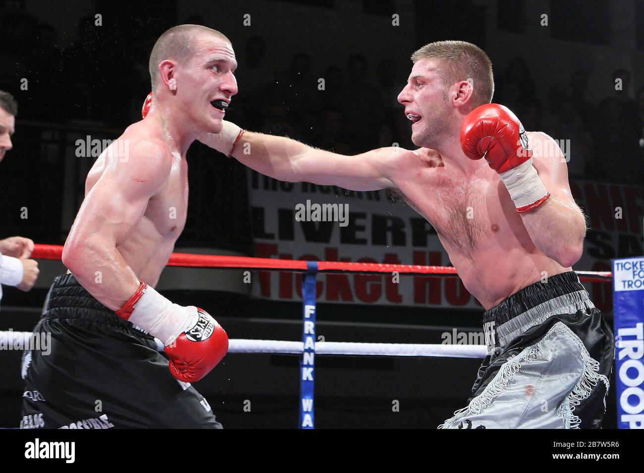 Ryan Walsh (black shorts) defeats James Ancliff in a Super-Bantamweight ...