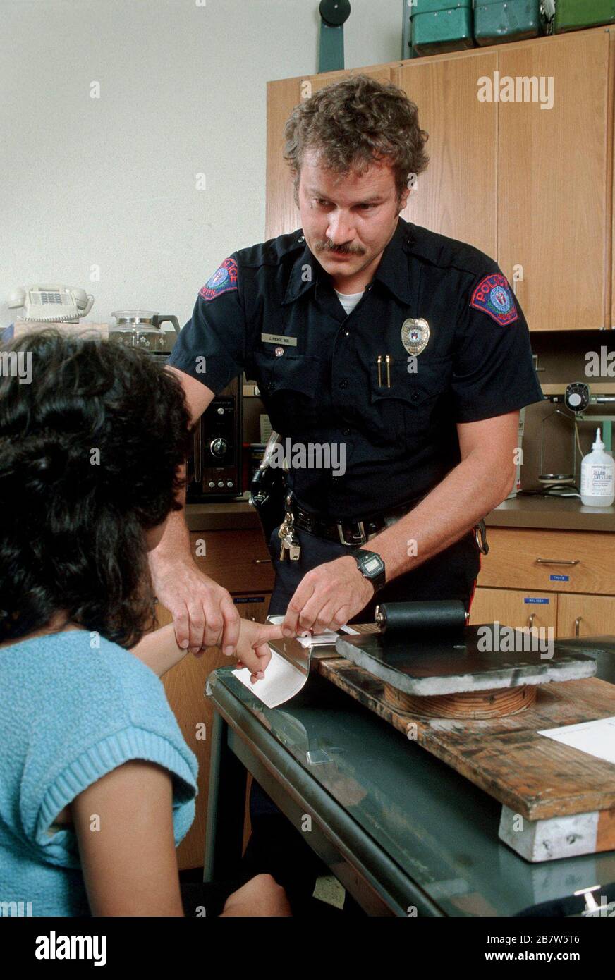 Police officer is taking fingerprints hi-res stock photography and ...