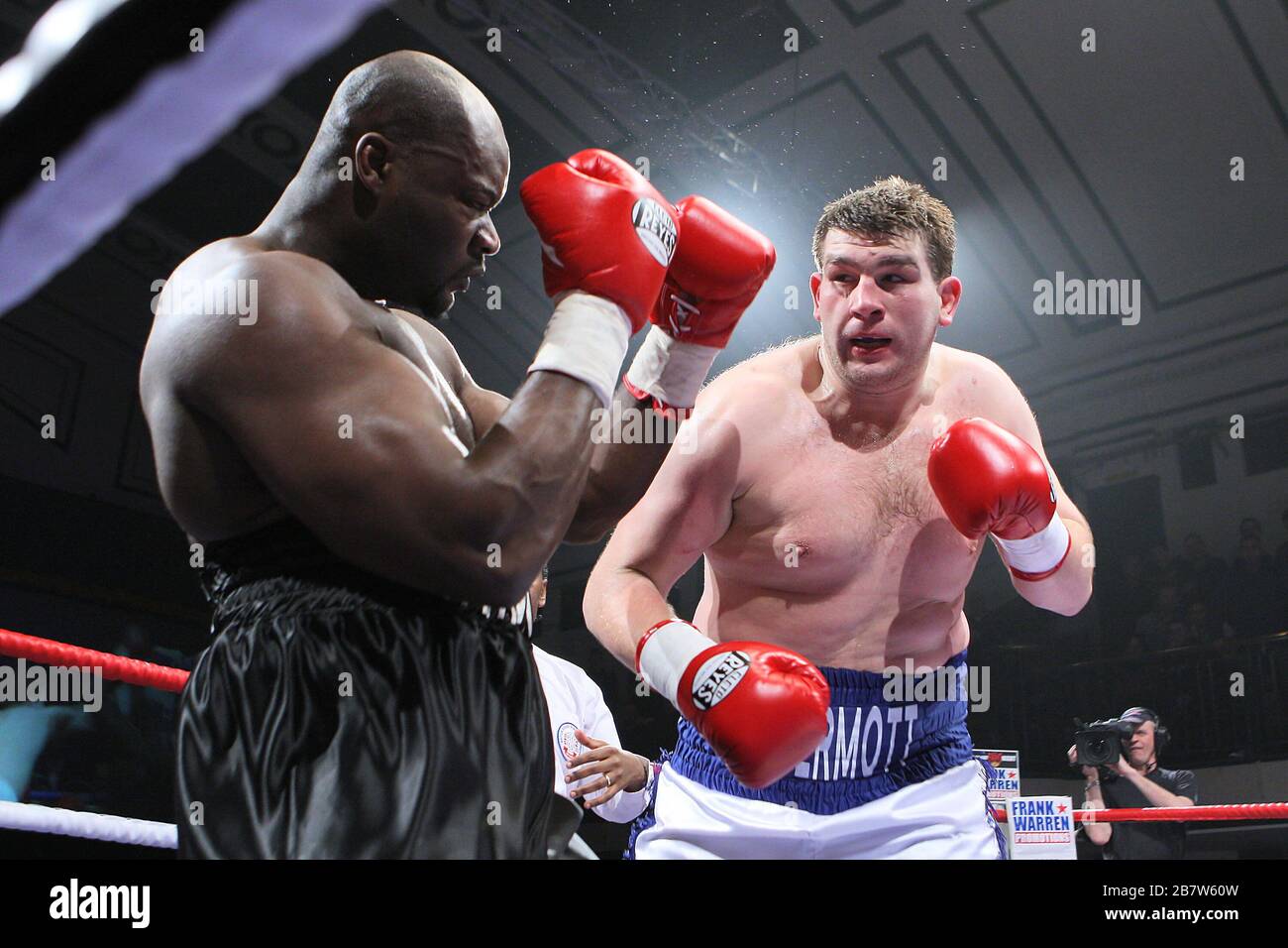 John McDermott (white/blue shorts) defeats Larry Olubamiwo in a ...