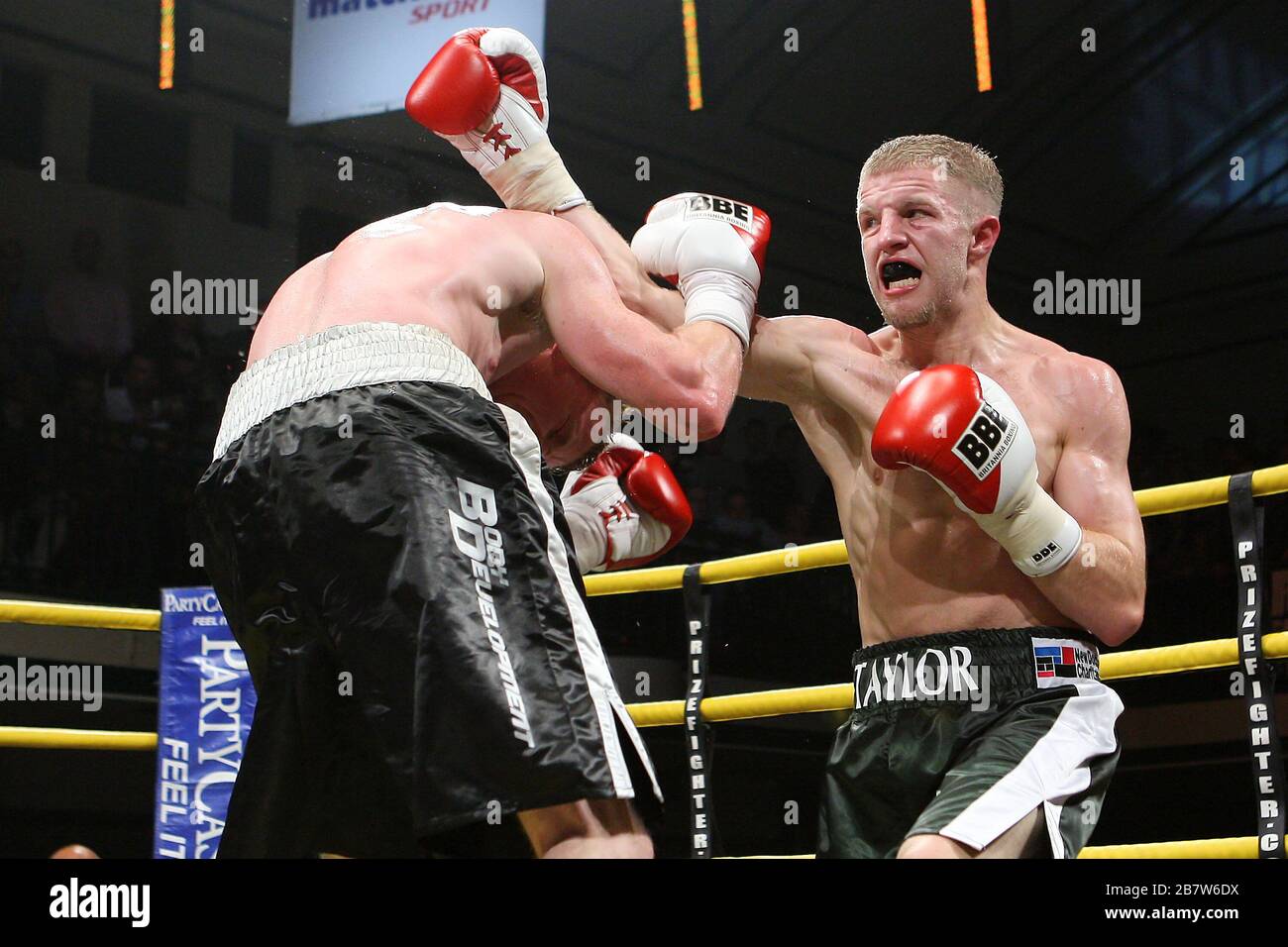 Ryan Taylor (dark green shorts) draws with Dan Carr (black shorts) in a ...