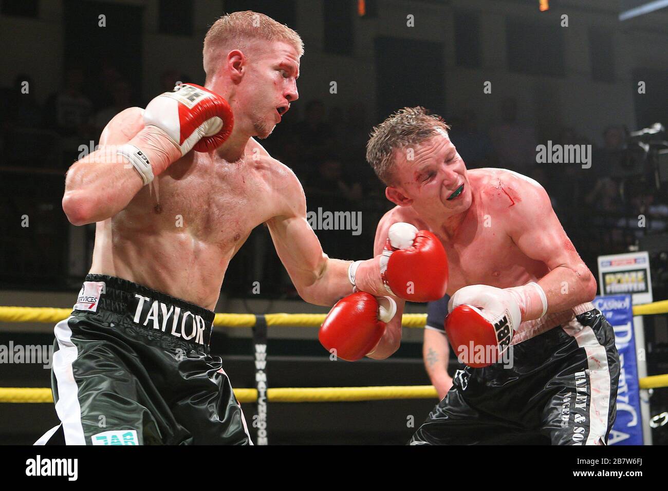 Ryan Taylor (dark green shorts) draws with Dan Carr (black shorts) in a ...