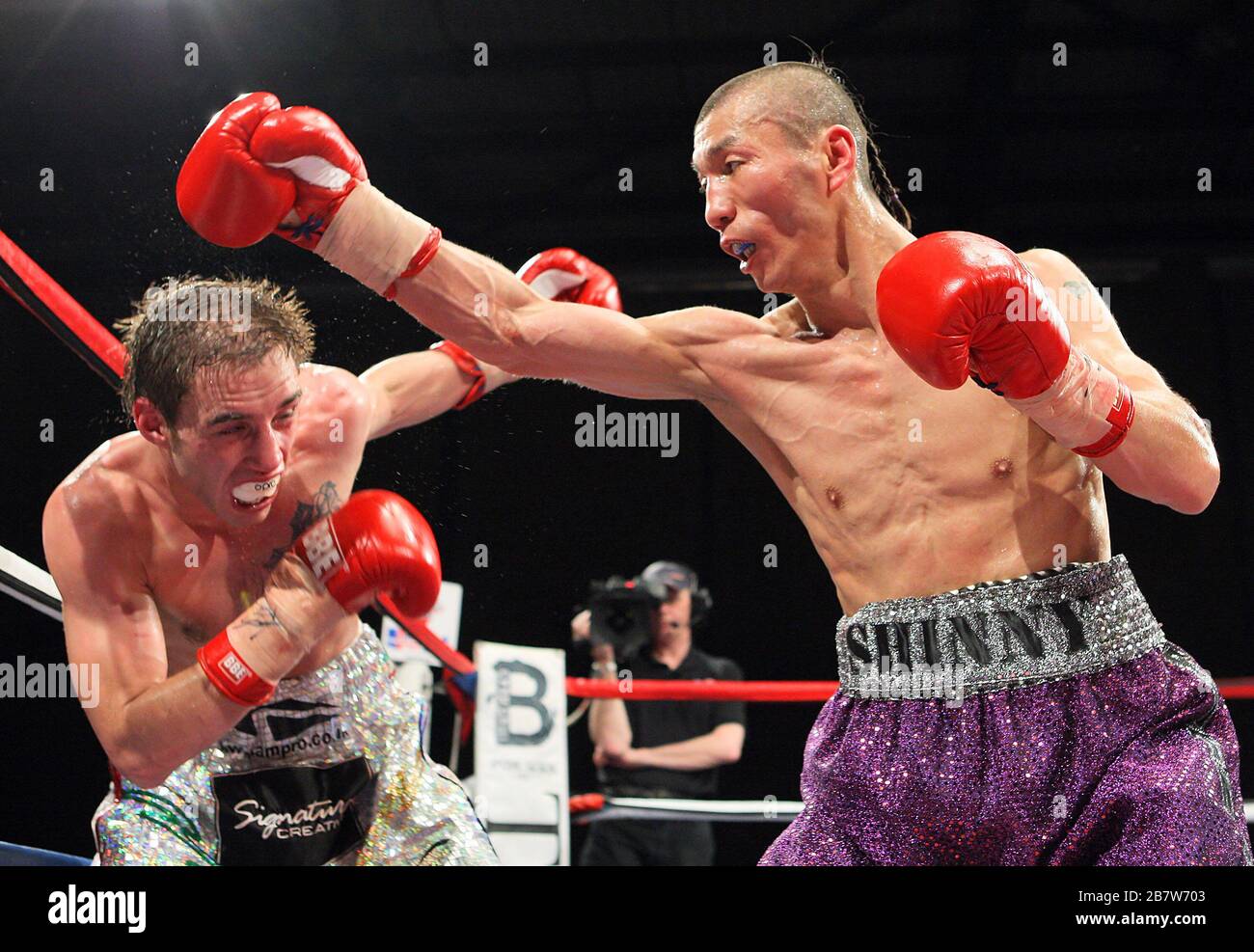 Shinny Bayaar (purple shorty) draws with Ashley Sexton in a Flyweight ...