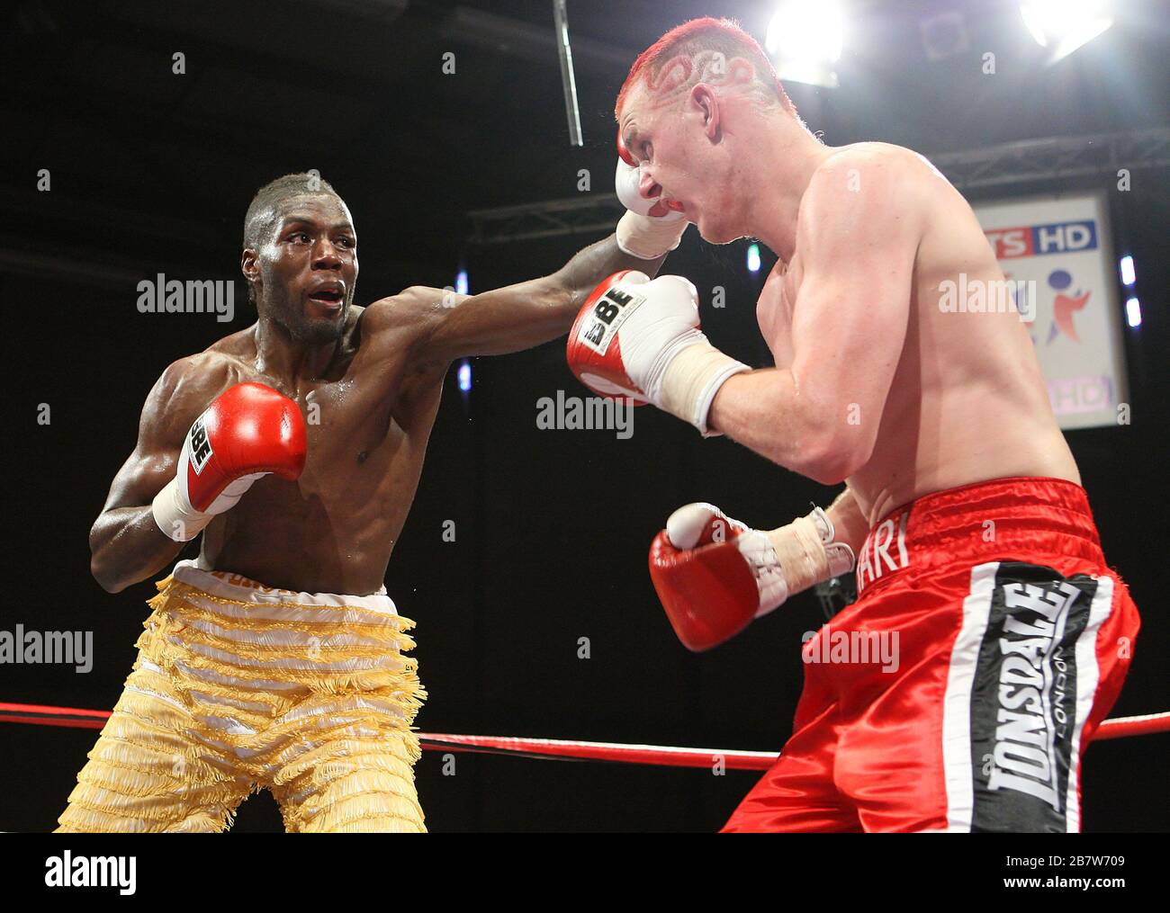 Menay Edwards (gold shorts) defeats Hari Miles in a Light-Heavyweight ...