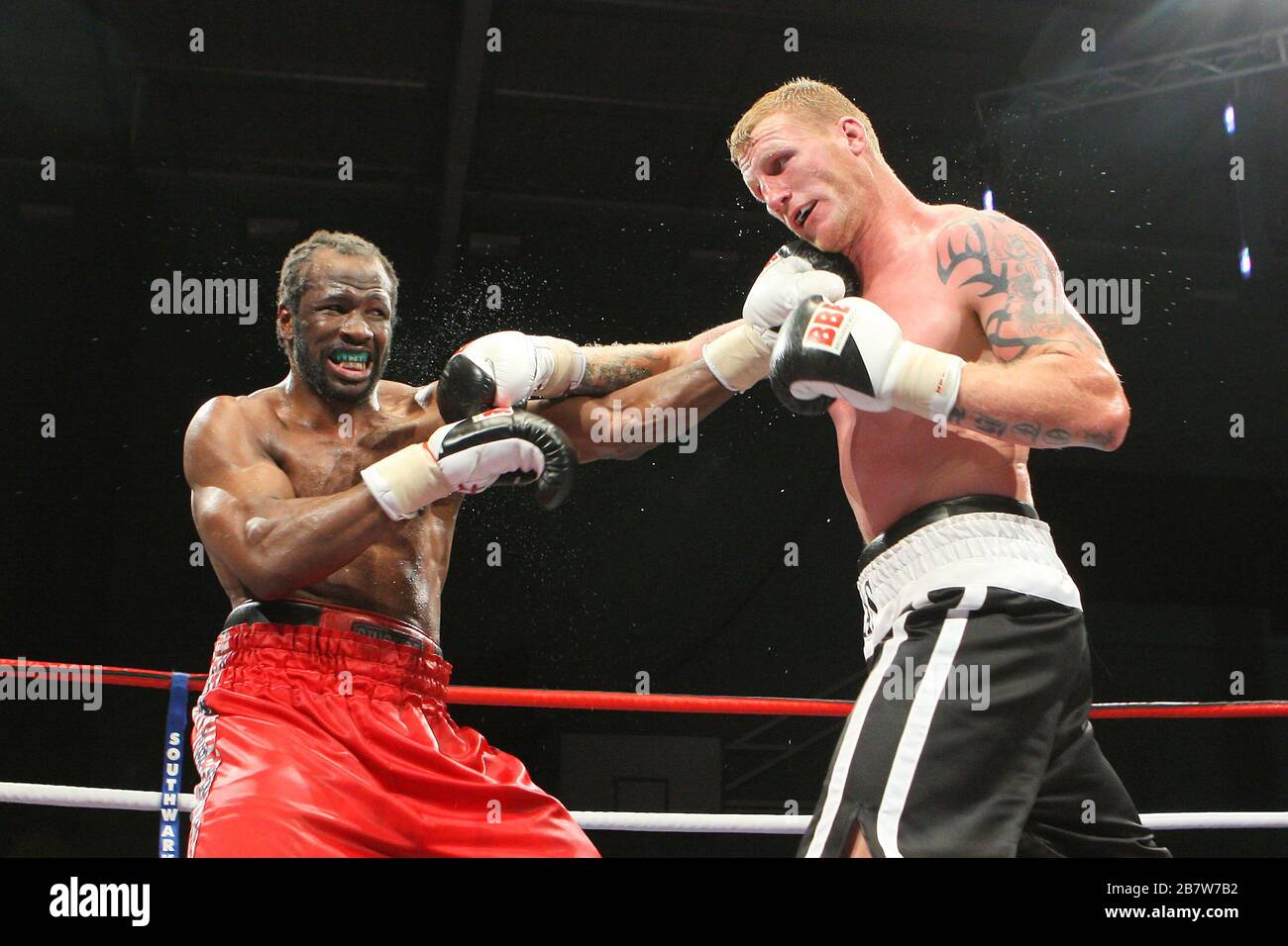 Tom Dallas (black shorts) defeats Zack Page (red shorts) in a ...