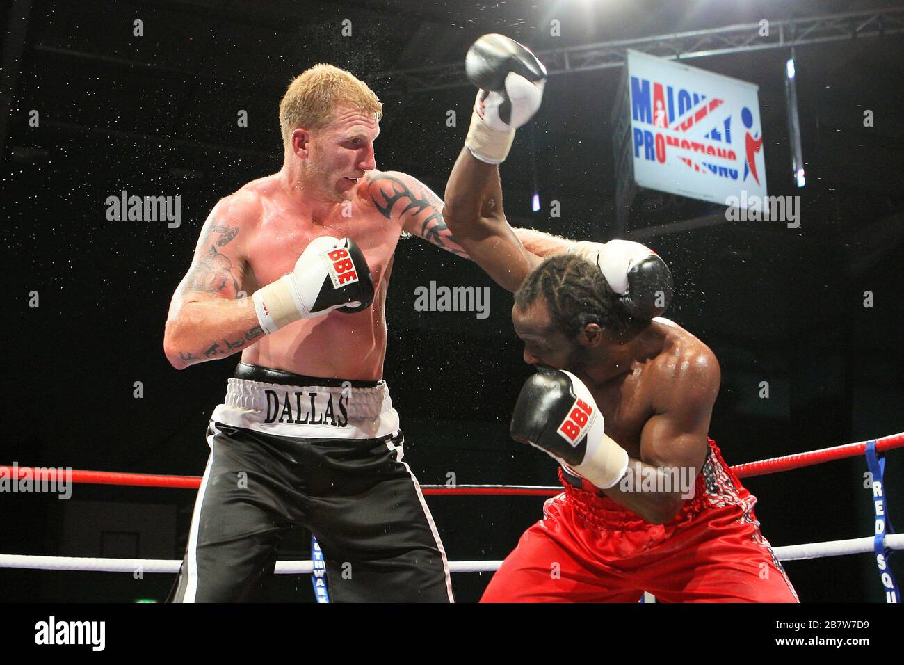 Tom Dallas (black shorts) defeats Zack Page (red shorts) in a ...