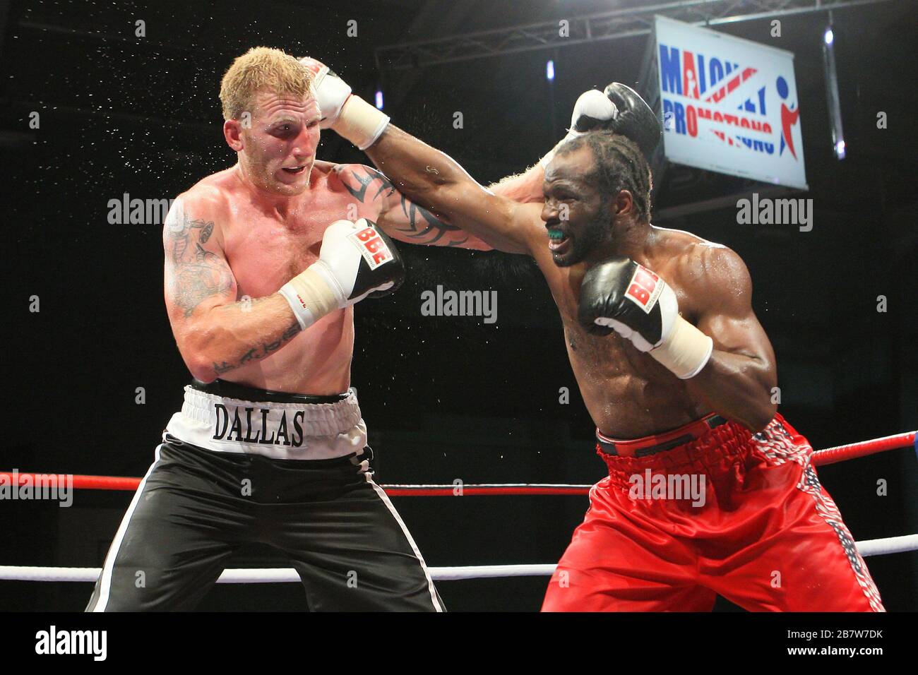 Tom Dallas (black shorts) defeats Zack Page (red shorts) in a ...
