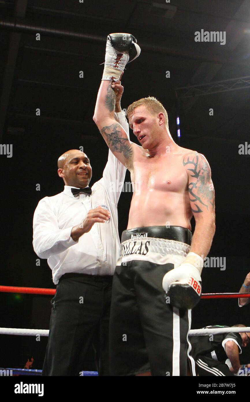 Tom Dallas (black shorts) defeats Zack Page (red shorts) in a ...