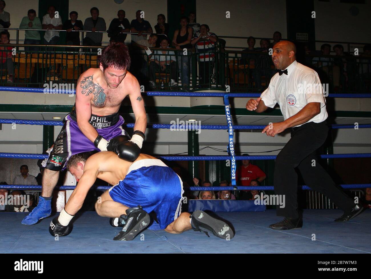 Phil Gill (Cheshunt, purple shorts) defeats in a Light-Welterweight ...