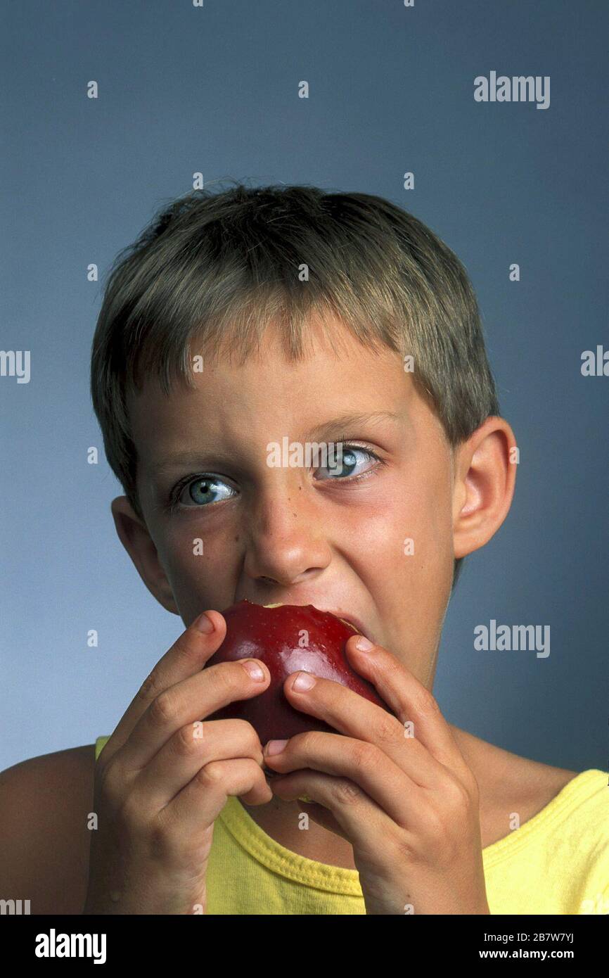 Child taking bite apple fruit hi-res stock photography and images - Alamy