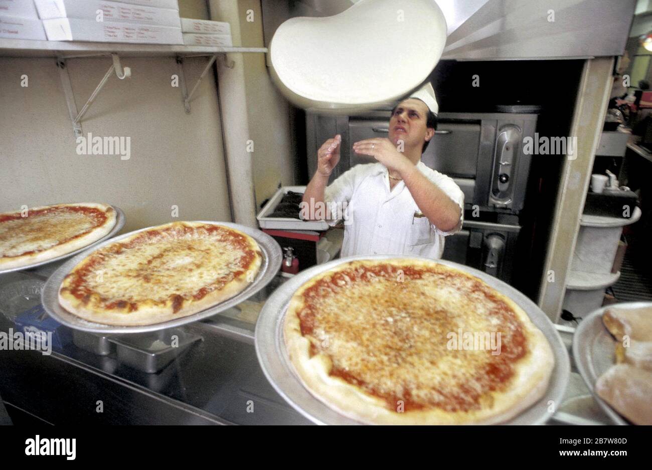 Hand tossed pizza dough hi-res stock photography and images - Alamy
