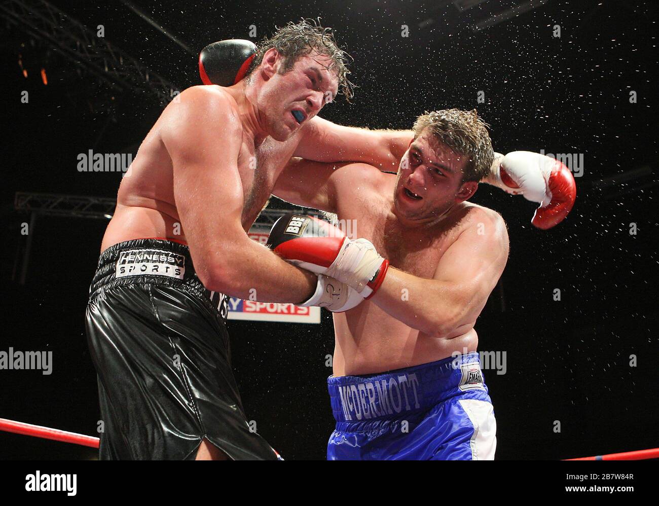Tyson Fury (black shorts) defeats John McDermott in a Heavyweight ...