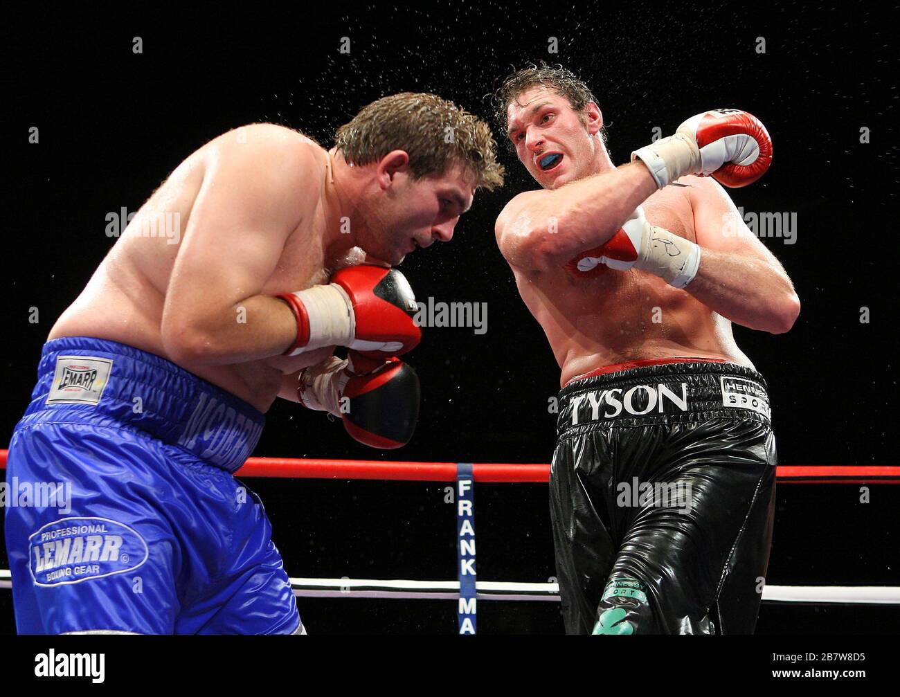Tyson Fury (black shorts) defeats John McDermott in a Heavyweight ...