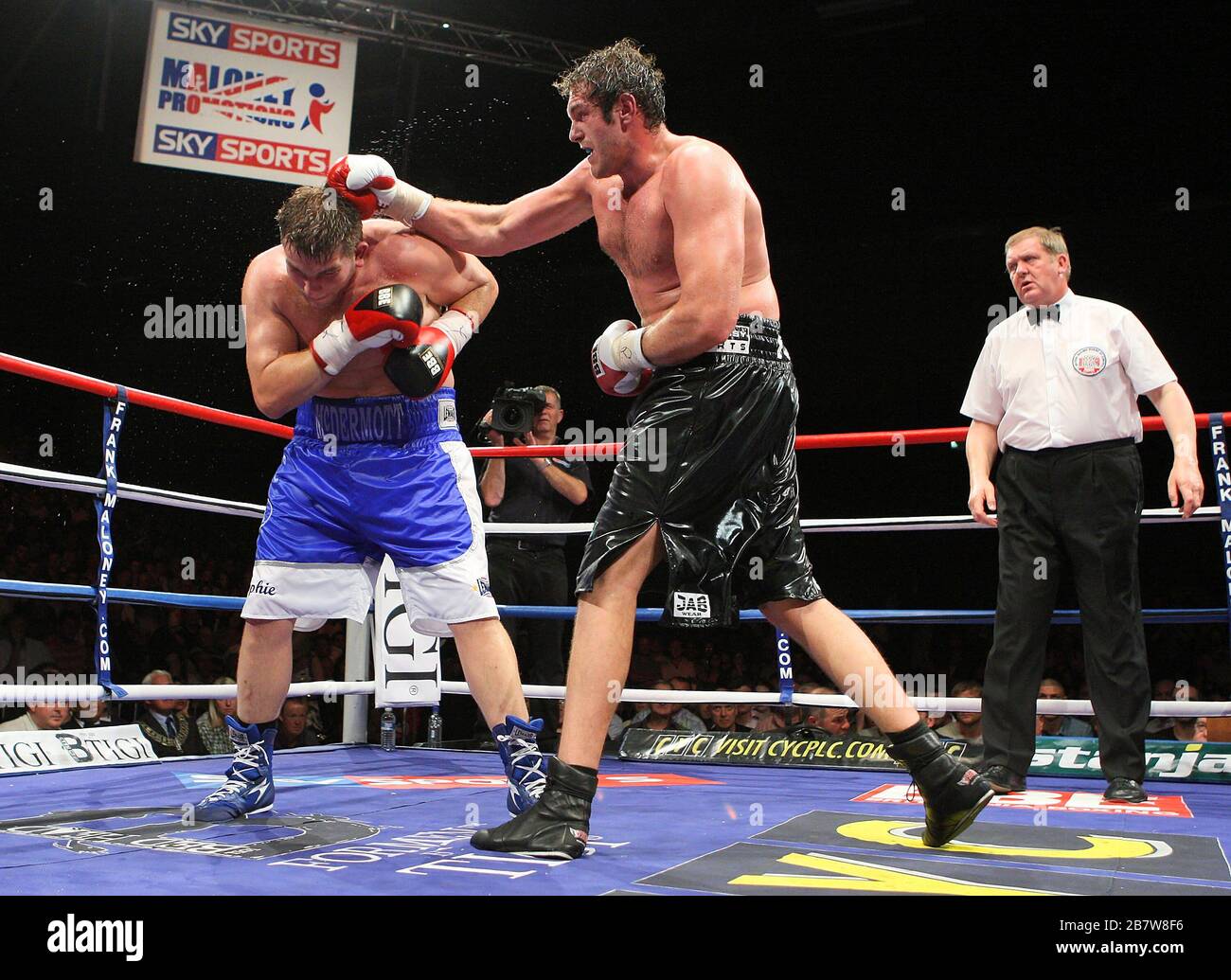 Tyson Fury (black shorts) defeats John McDermott in a Heavyweight ...