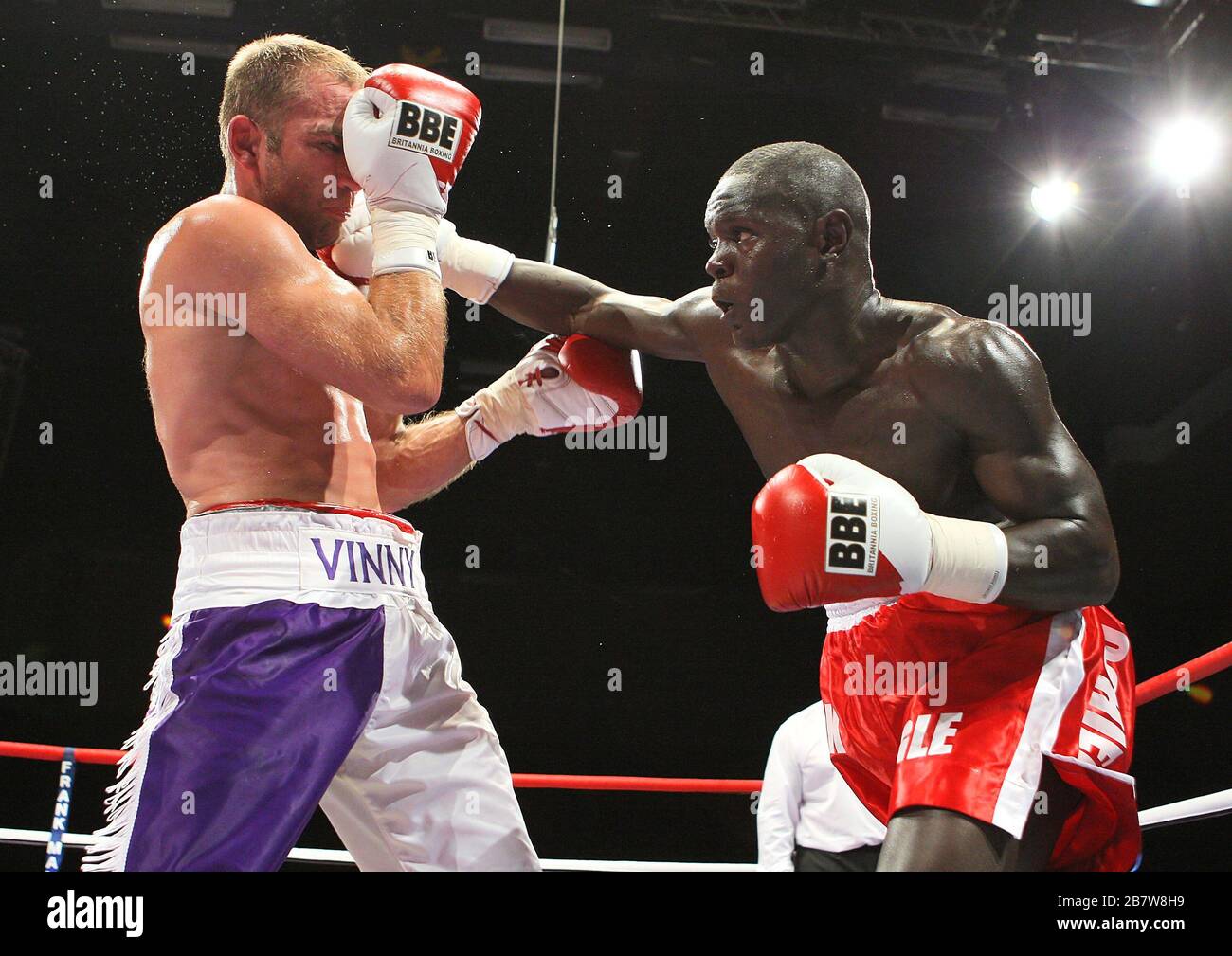 Eric Ochieng (red shorts) defeats Matt Scriven in a Light-Middleweight ...