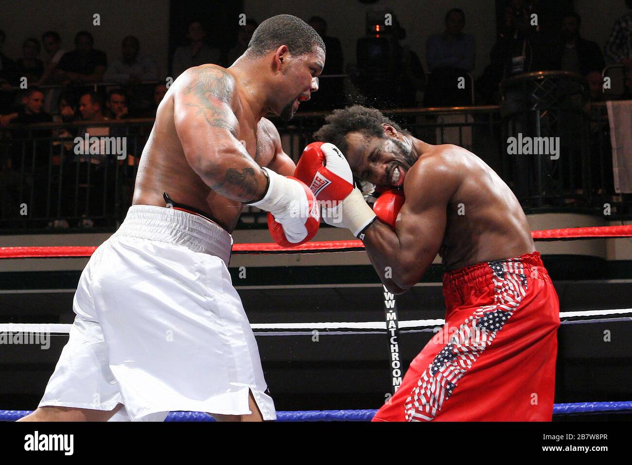 Mike Perez (white shorts) defeats Zack Page in a Heavyweight boxing ...