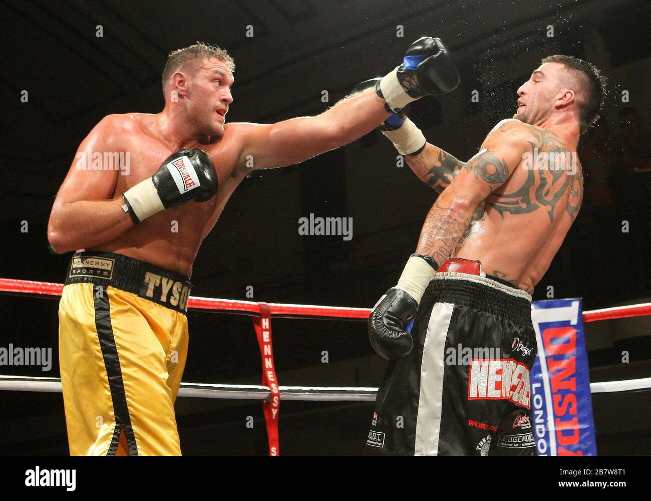 Tyson Fury (gold shorts) defeats Rich Power in a Heavyweight boxing ...