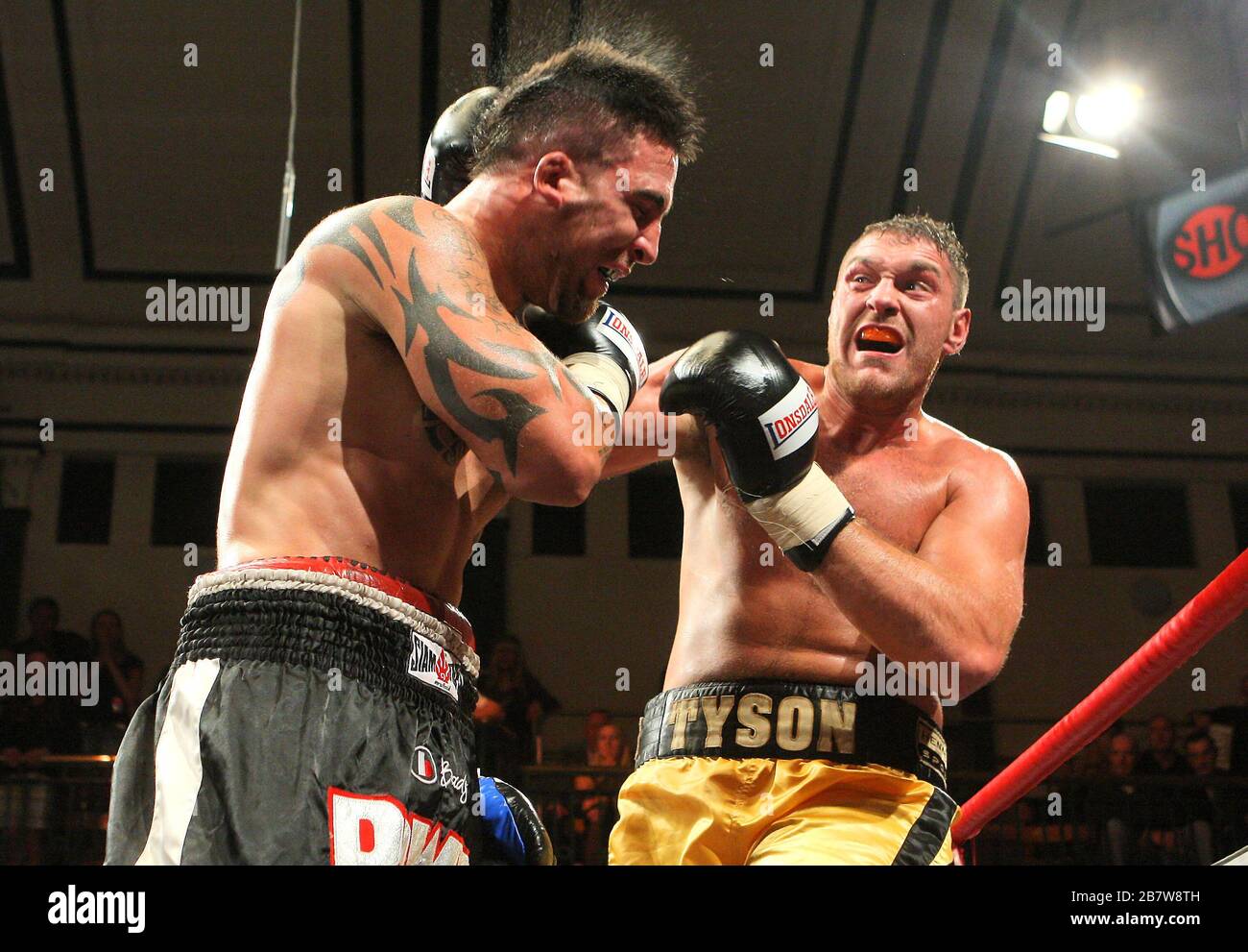 Tyson Fury (gold shorts) defeats Rich Power in a Heavyweight boxing ...