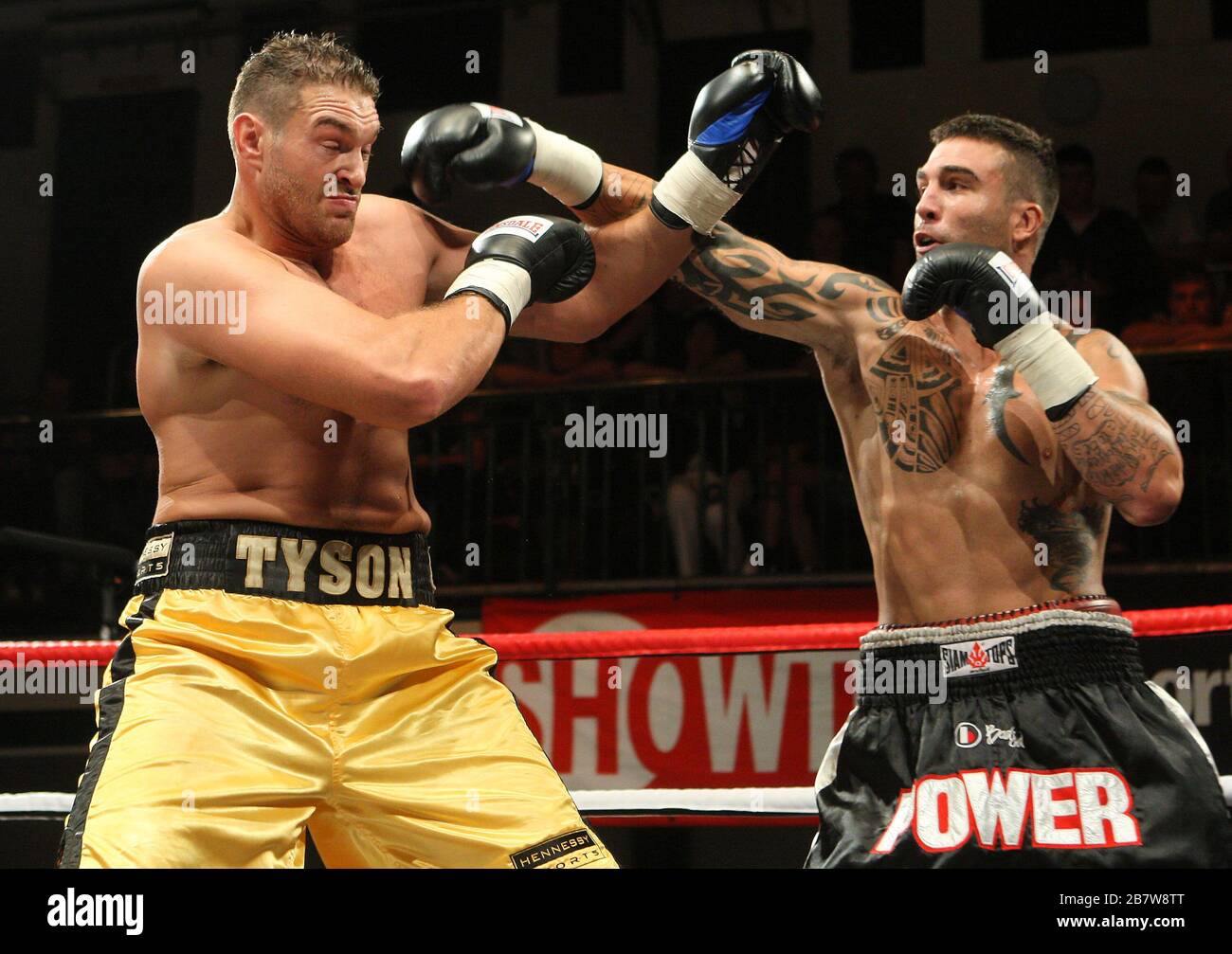 Tyson Fury (gold shorts) defeats Rich Power in a Heavyweight boxing ...