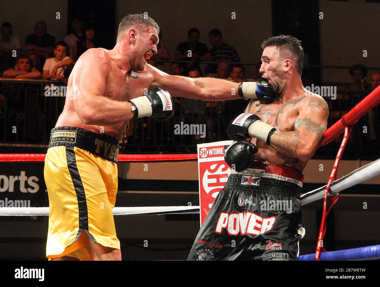 Tyson Fury (gold shorts) defeats Rich Power in a Heavyweight boxing ...