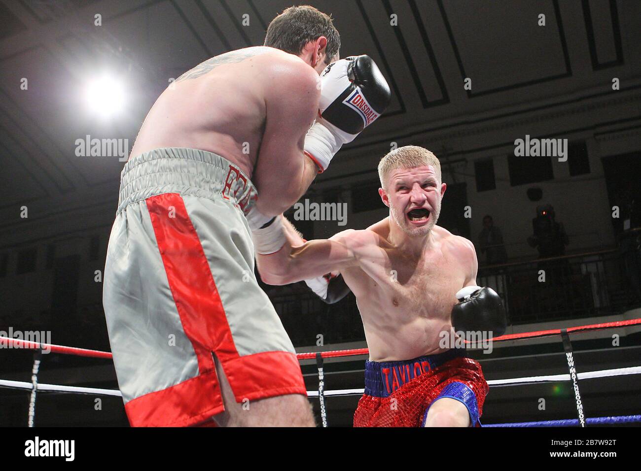 Ryan Taylor (red/blue shorts) defeats Graham Fearn in a Lightweight ...
