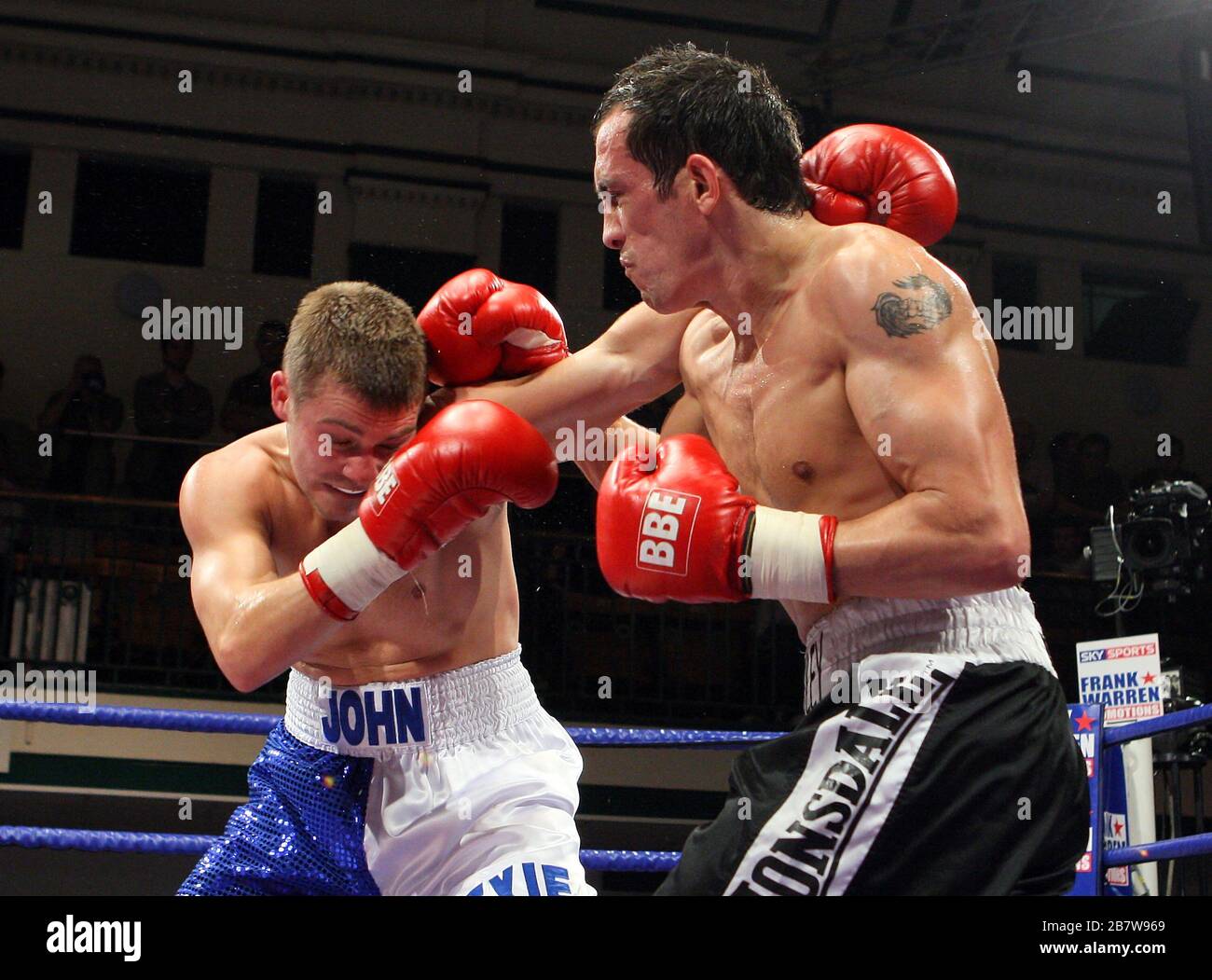 John Wayne Hibbert (blue.white shorts) defeats Kevin McCauley in a ...