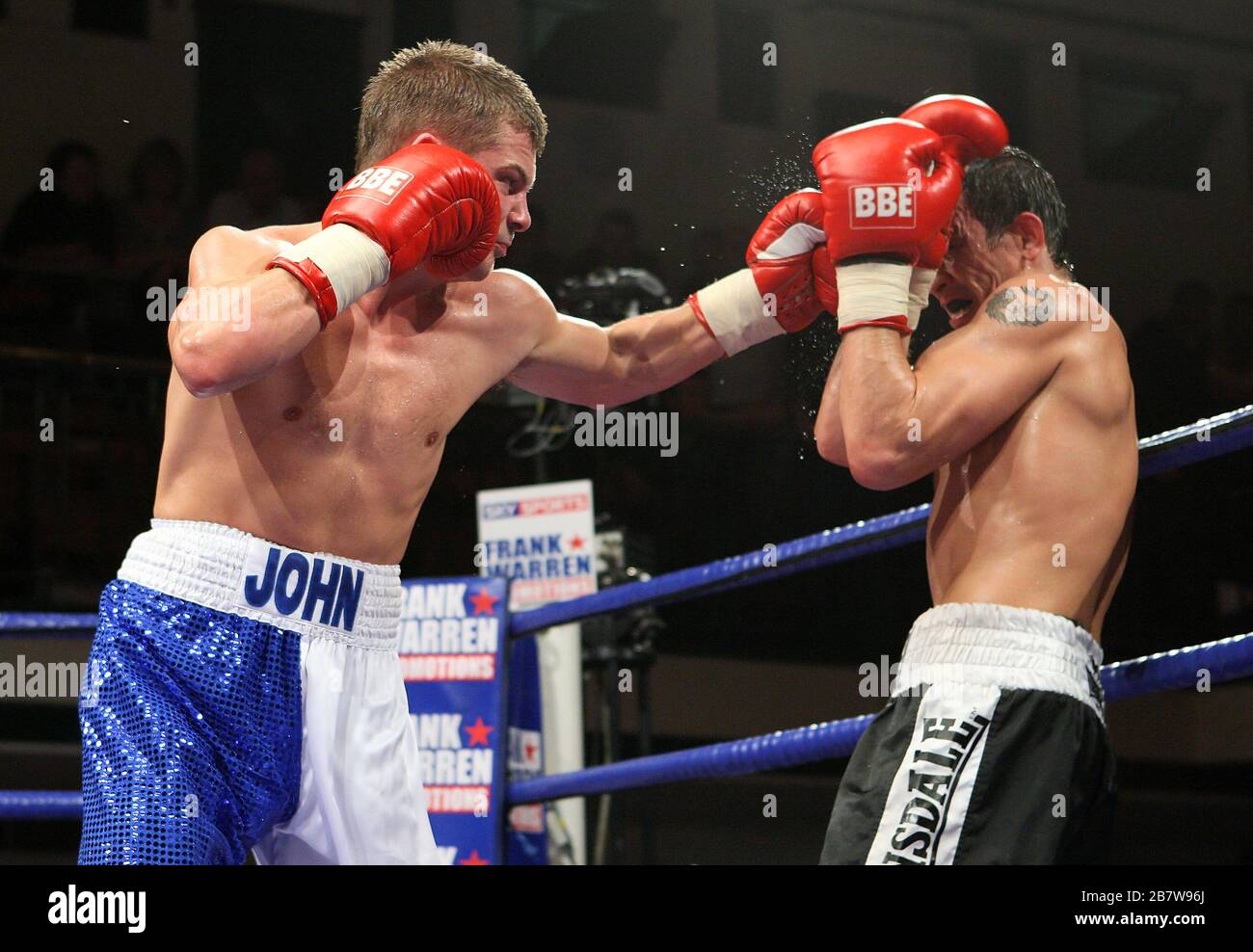 John Wayne Hibbert (blue.white shorts) defeats Kevin McCauley in a ...