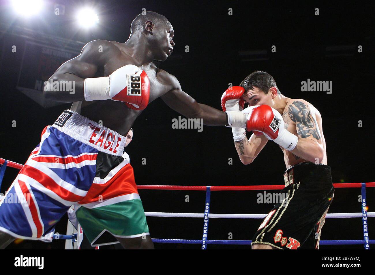Erick Ochieng (multicoloured shorts) defeats Lee Noble in a Super ...